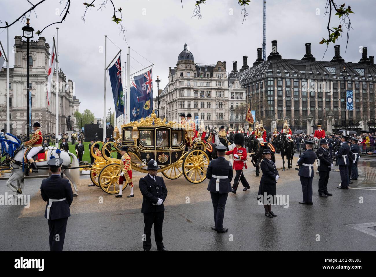 King Charles III and Queen Camilla are carried in the Gold State Coach ...