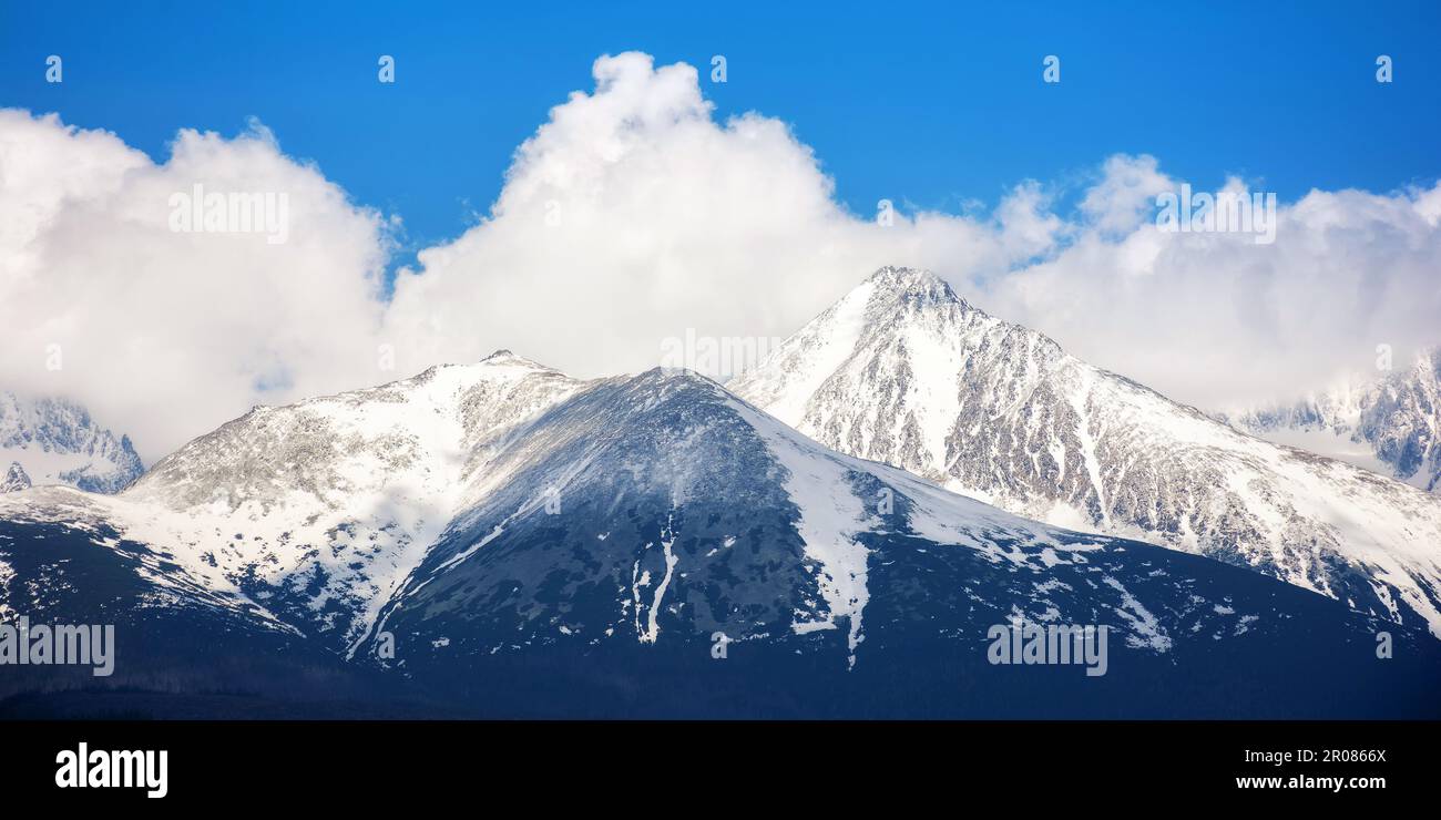 background image of high tatra peaks in spring. sunny scenery with ...