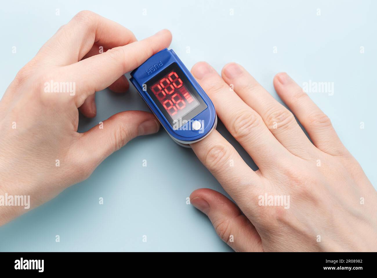 Pulse oximeter measuring oxygen saturation in blood and heart rate ...