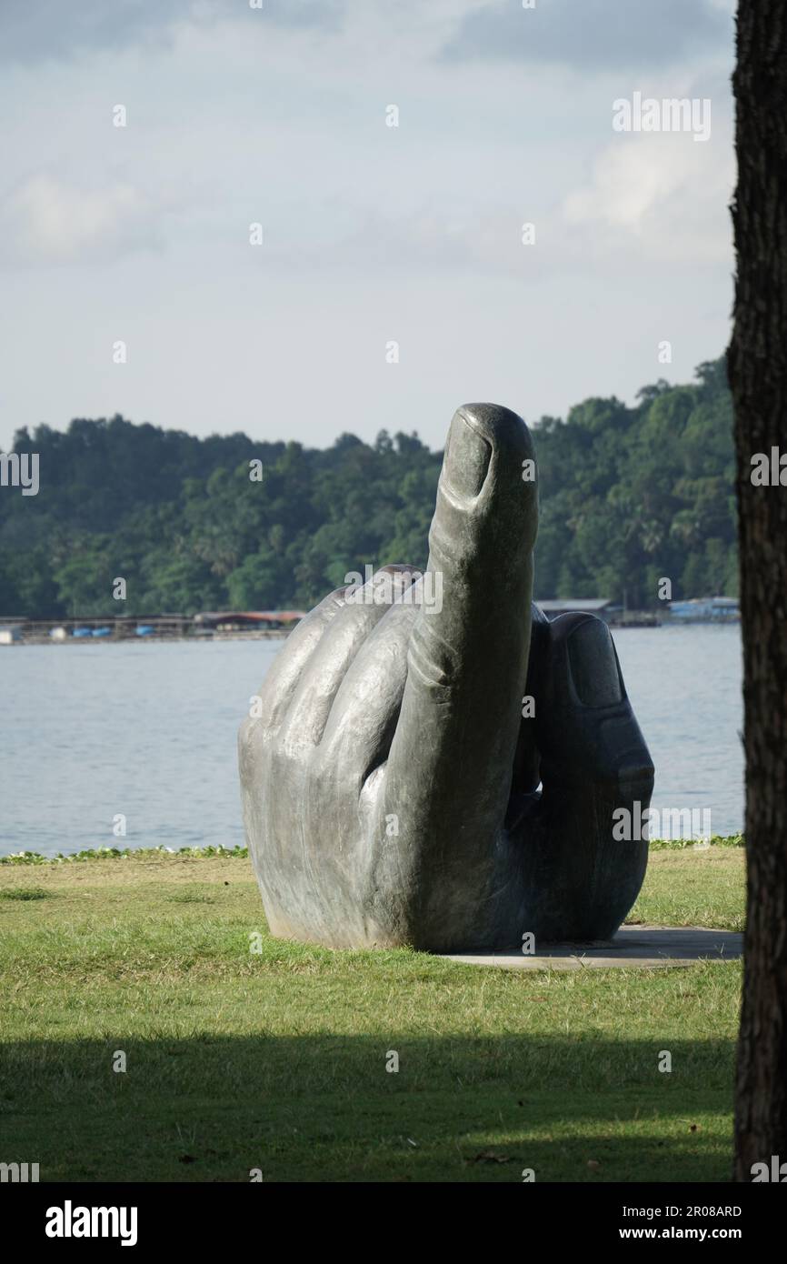 Pointer finger statue at Changi Beach point Stock Photo - Alamy