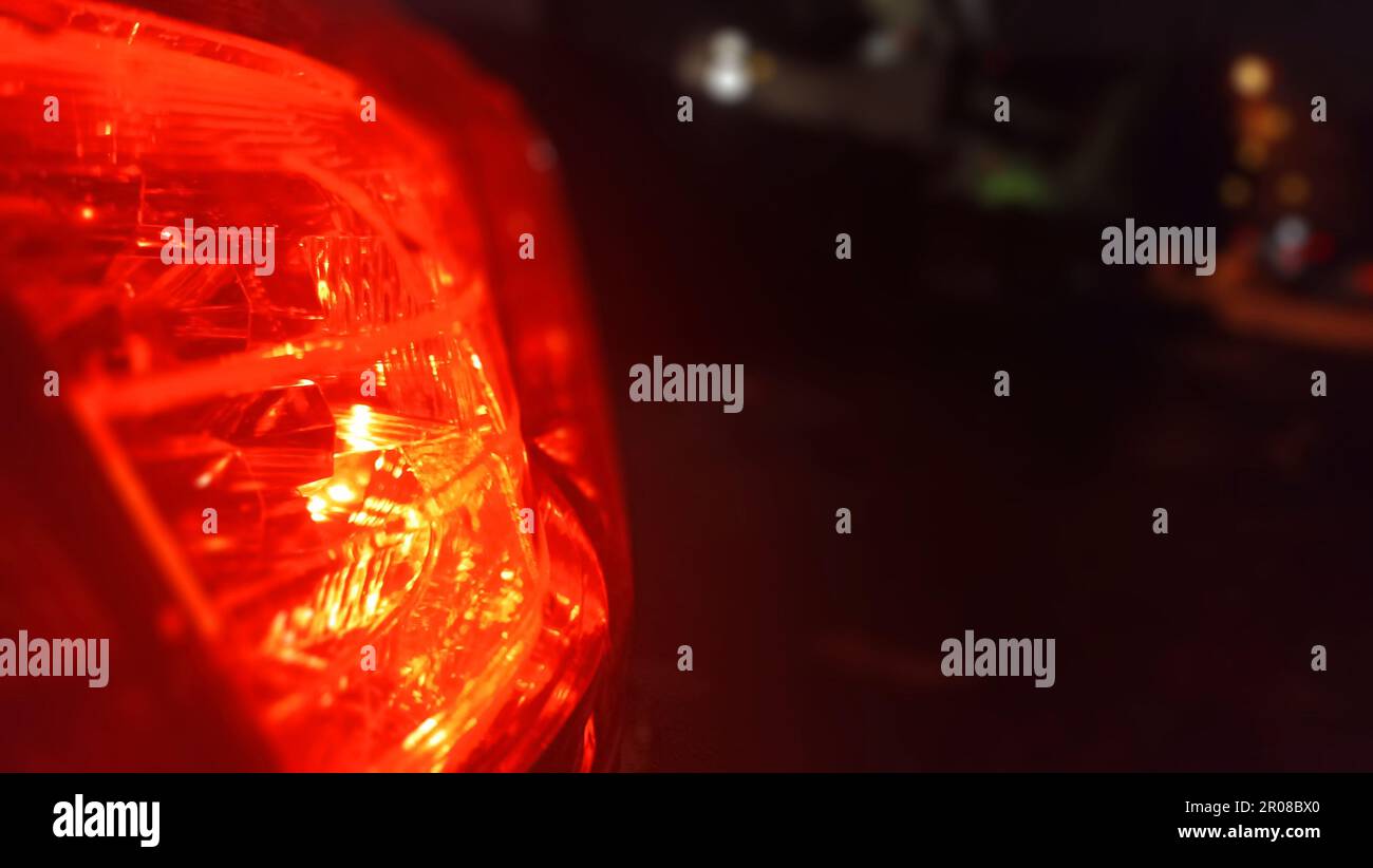 Blur background photo of red car lights on a dark night background ...