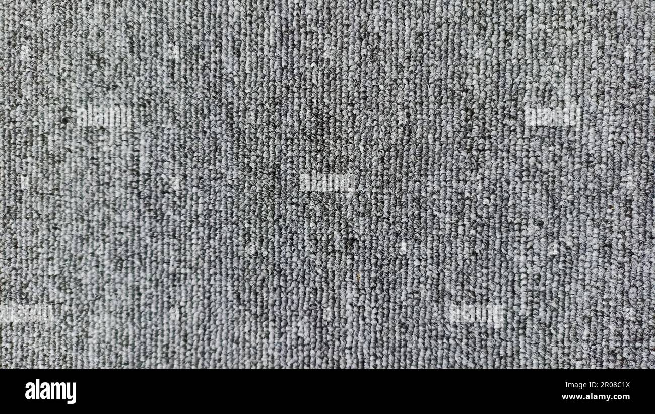 Gray fiber textured carpet background Stock Photo - Alamy