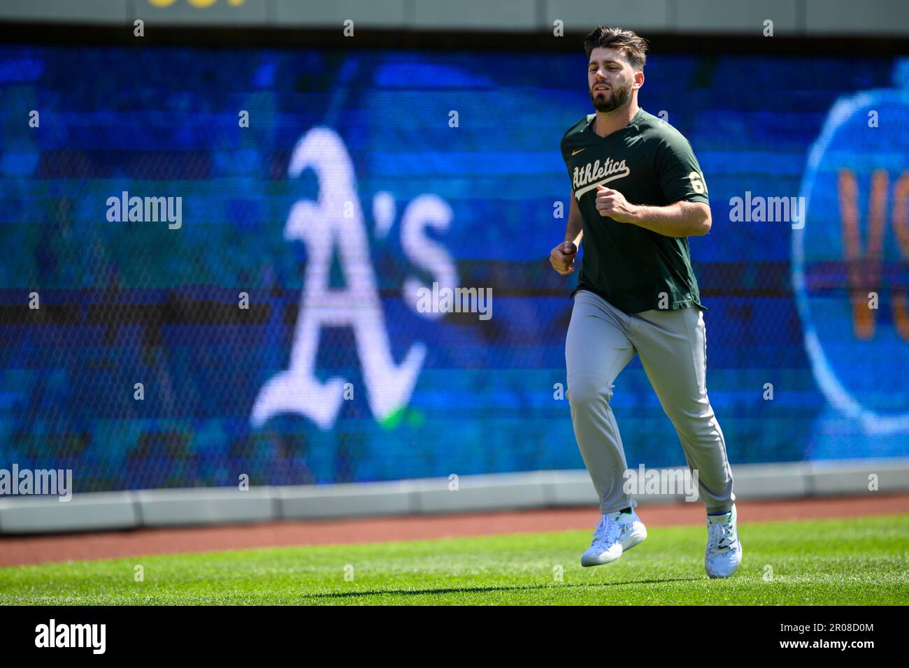 Oakland Athletics relief pitcher Sam Moll runs during warmups before a ...