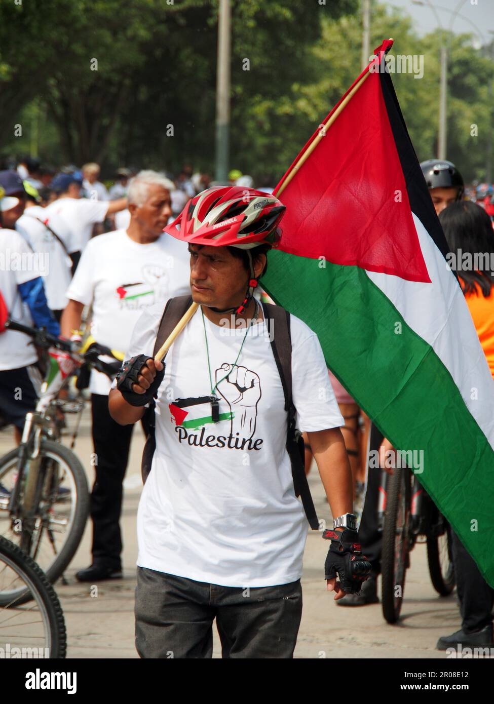 A man carrying a Palestinian flag when thousands of people participate ...