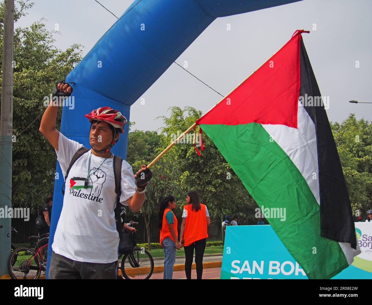 A man carrying a Palestinian flag when thousands of people participate ...