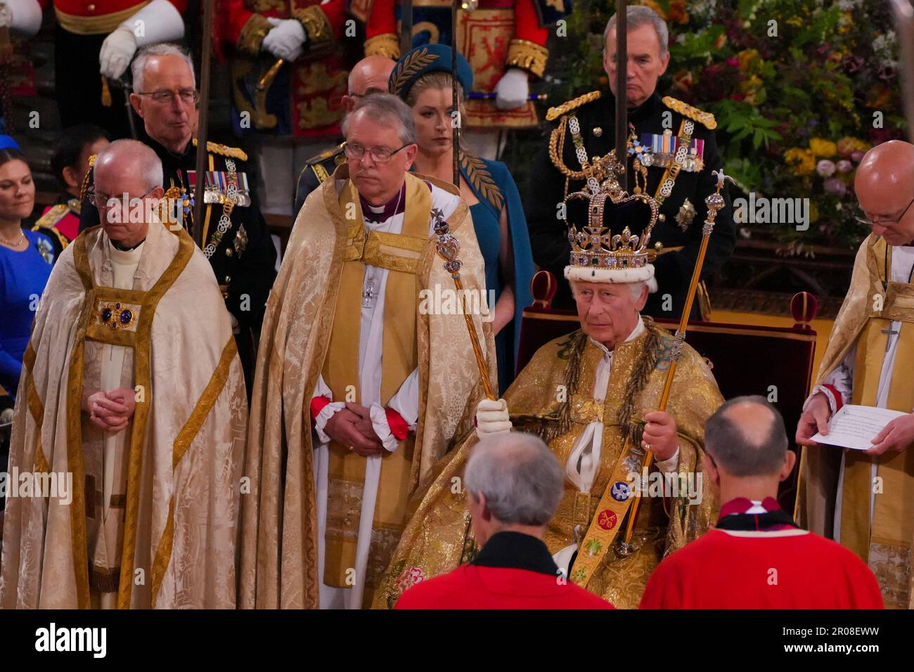 King Charles III (front centre) seated in St Edward's Chair, also known ...