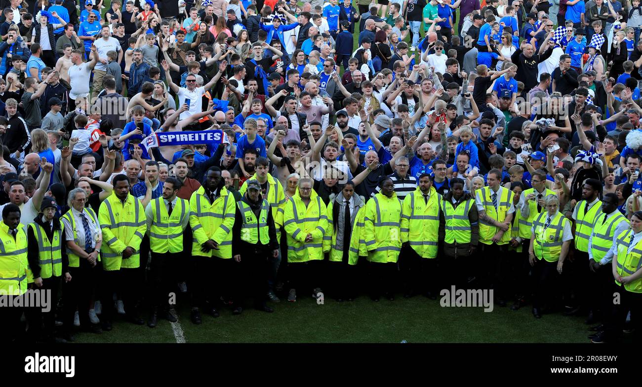 Chesterfield fans celebrate on the pitch at full time after the ...