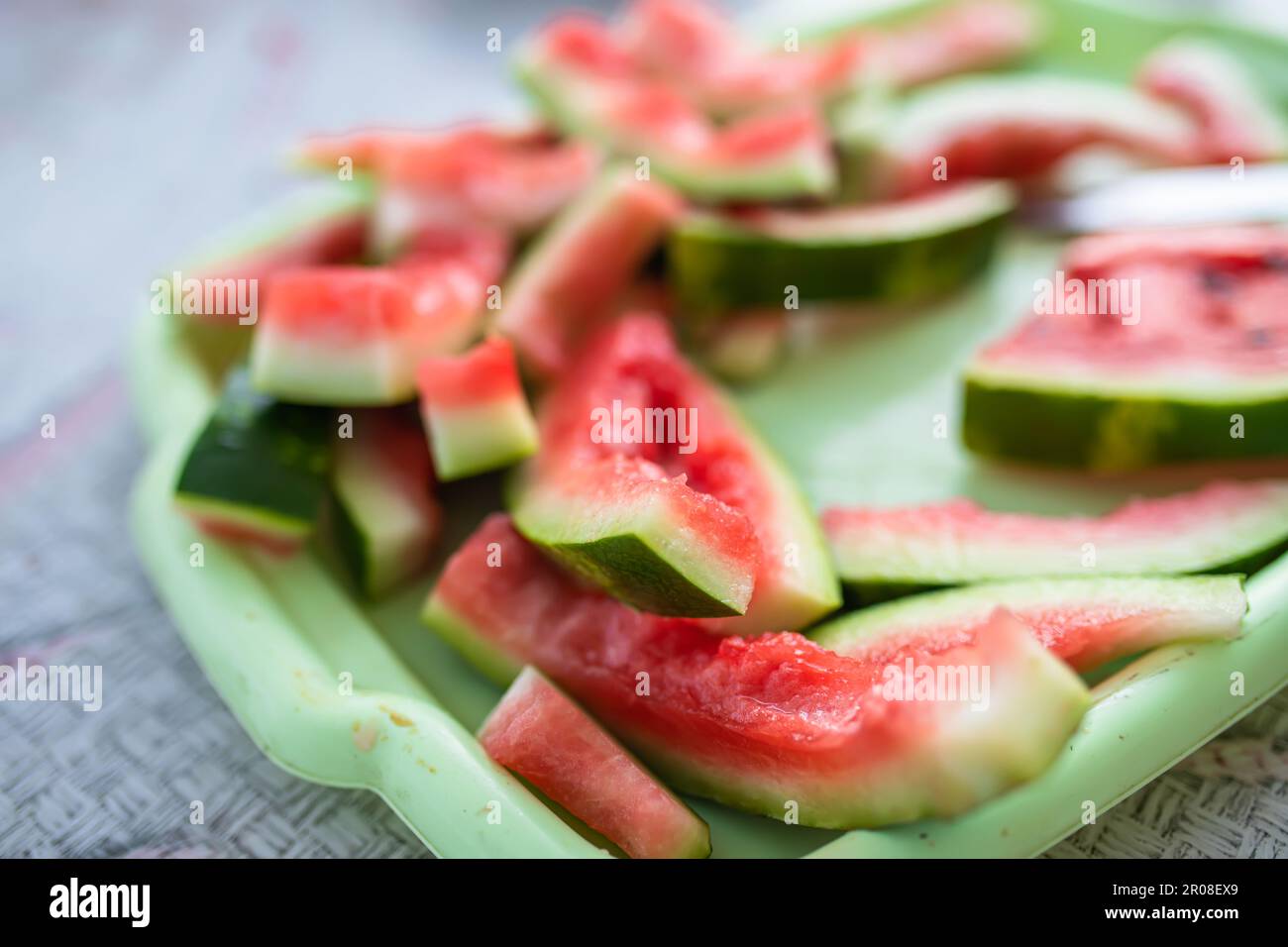 Skins from eaten watermelon on a tray. A lot of delicious watermelon ...