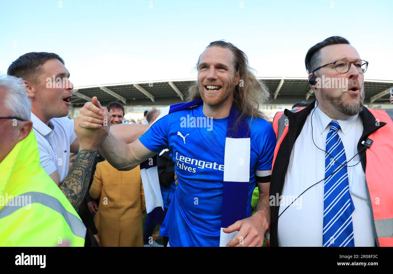 Chesterfield's Jamie Grimes celebrates with fans on the pitch at full ...