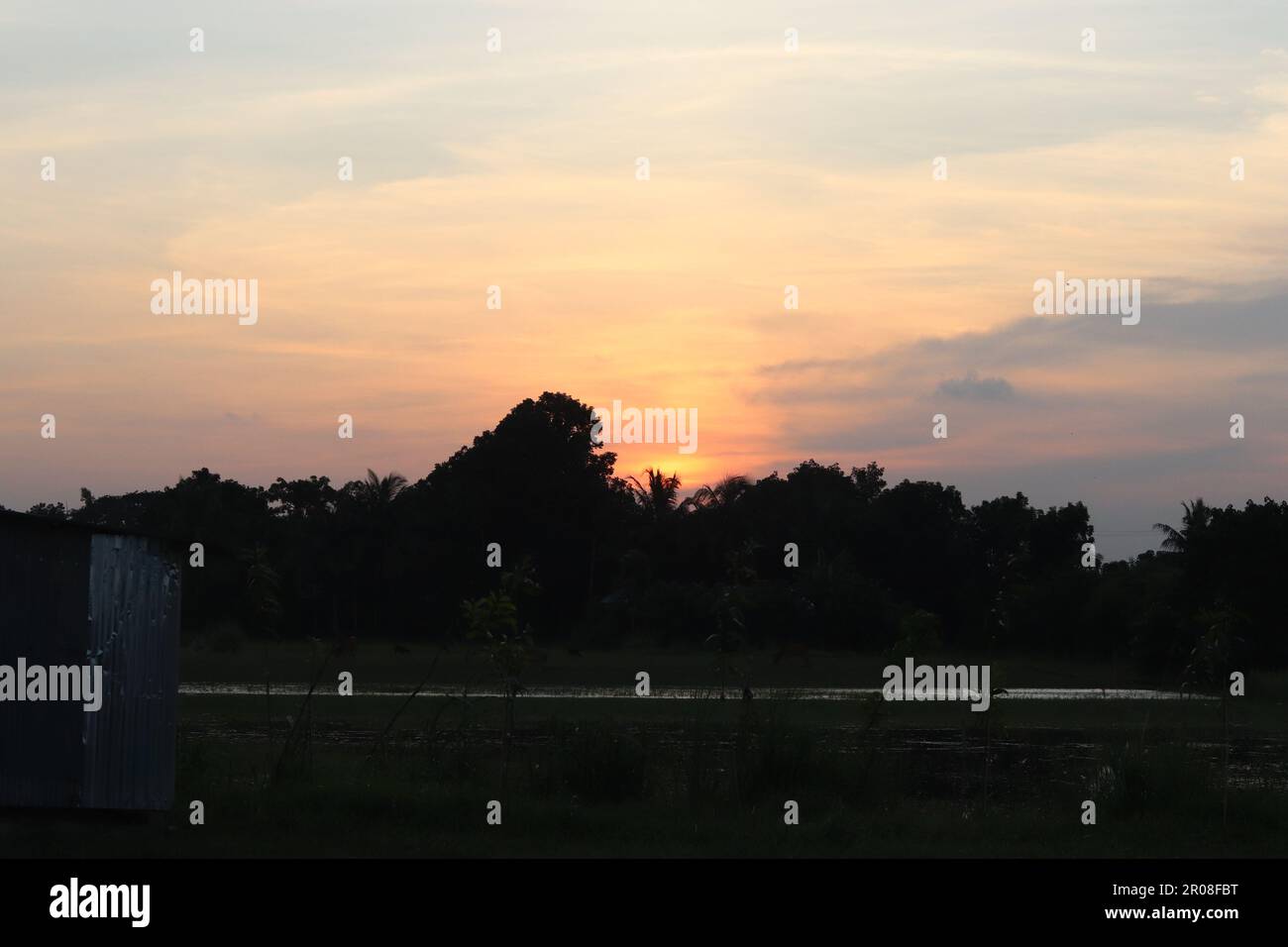 sunset in village area. last time of a village day. Bangladeshi village ...