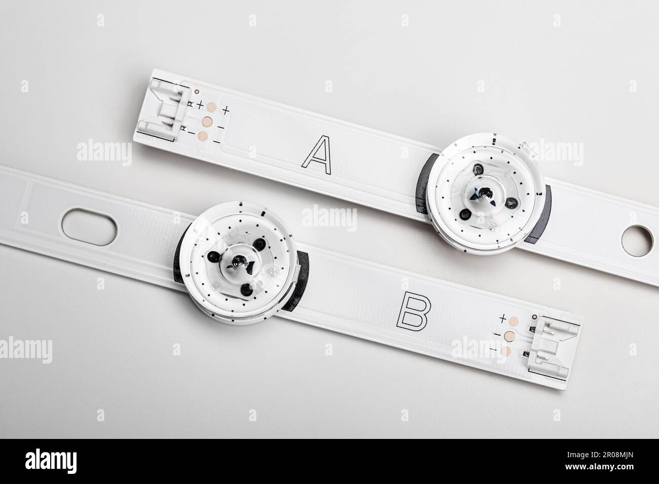 Close up LED lights with connectors. Backlight of LED TV sets. Modern ...