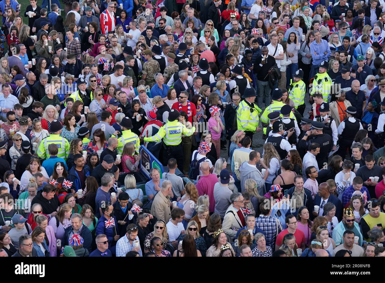 Police officers managing the crowd congestion between the food and ...
