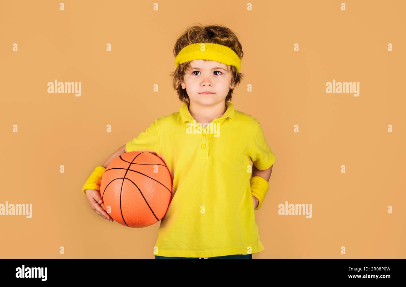 Cute little child with basketball ball. Sport equipment. Basketball ...