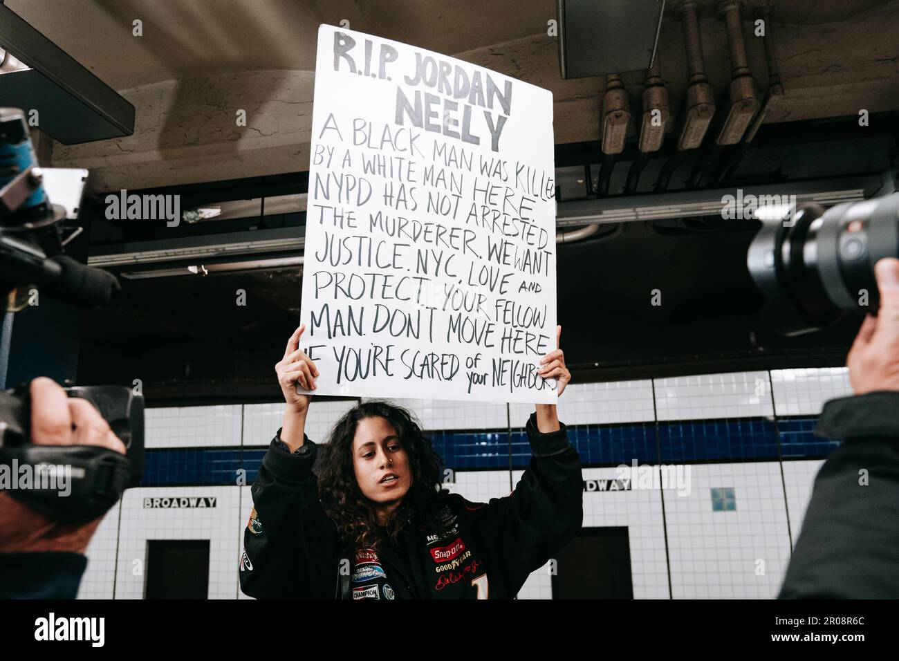 New York, USA. 3rd May, 2023. A protestor holds a placard bearing ...