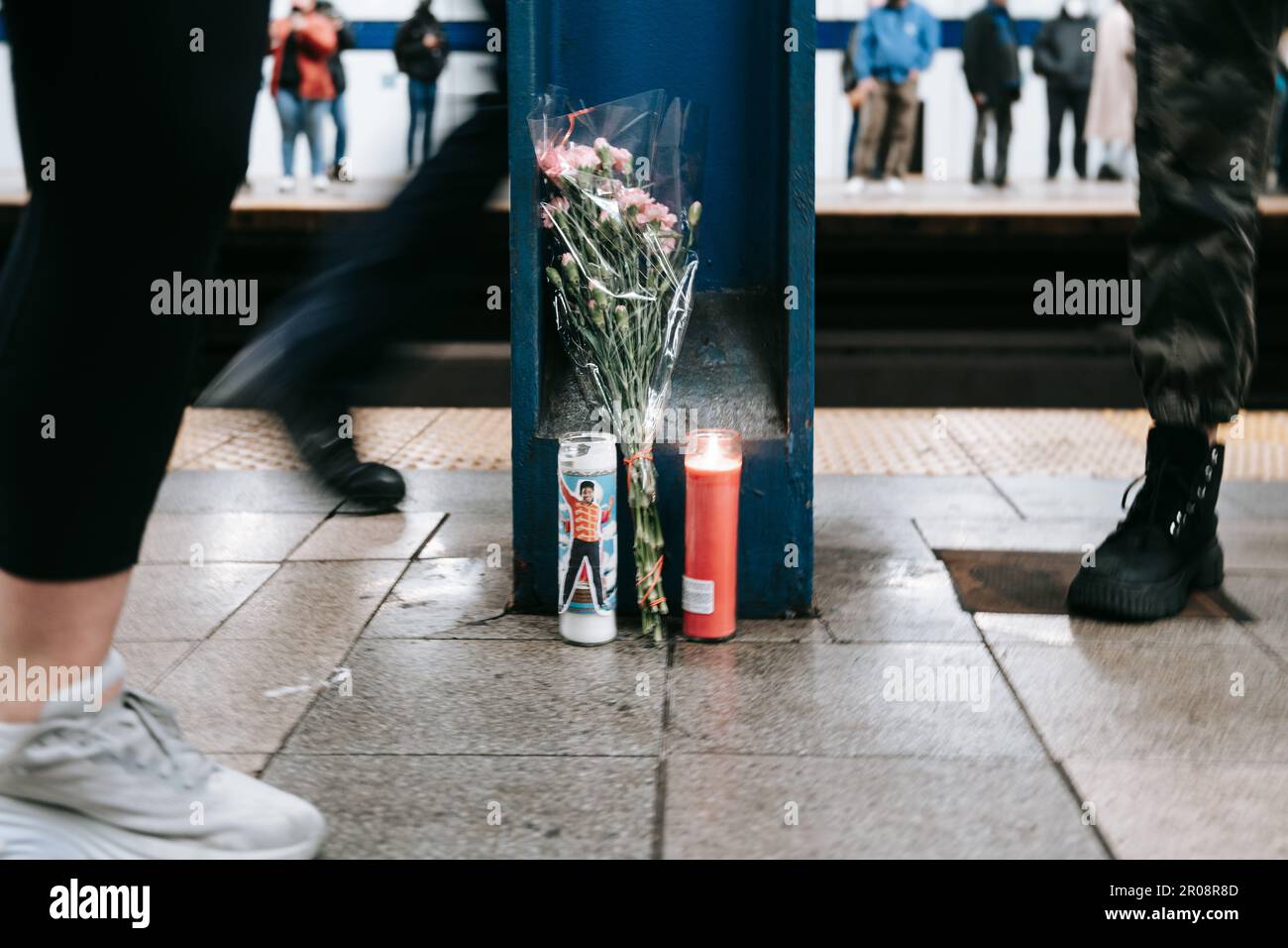 New York, USA. 3rd May, 2023. People walk past a makeshift memorial to ...