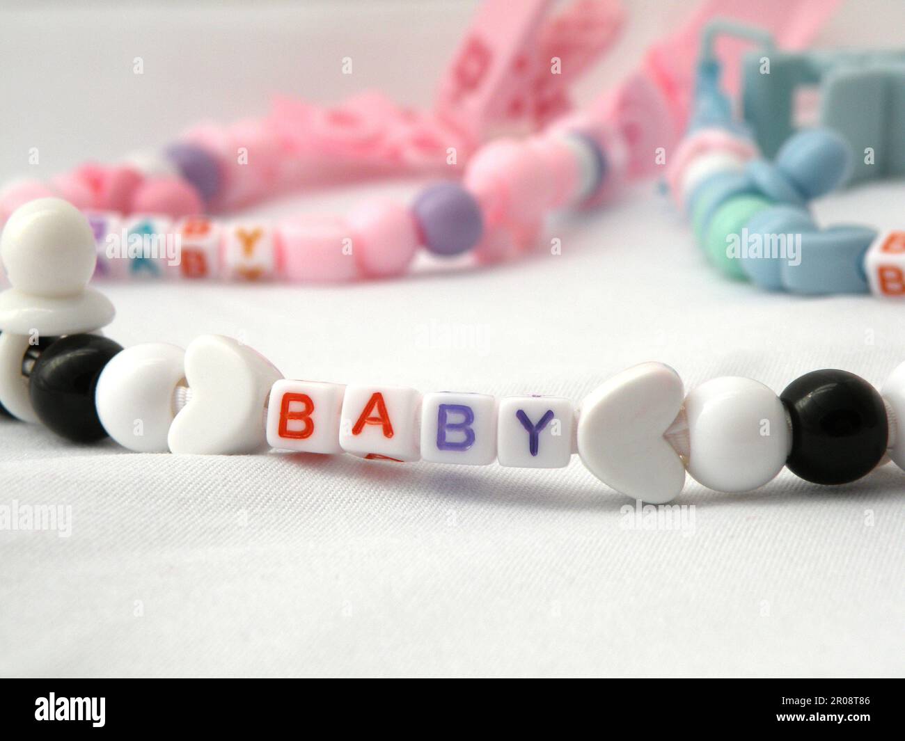 Baby word formed with cubes that are part of a pacifier clip Stock ...