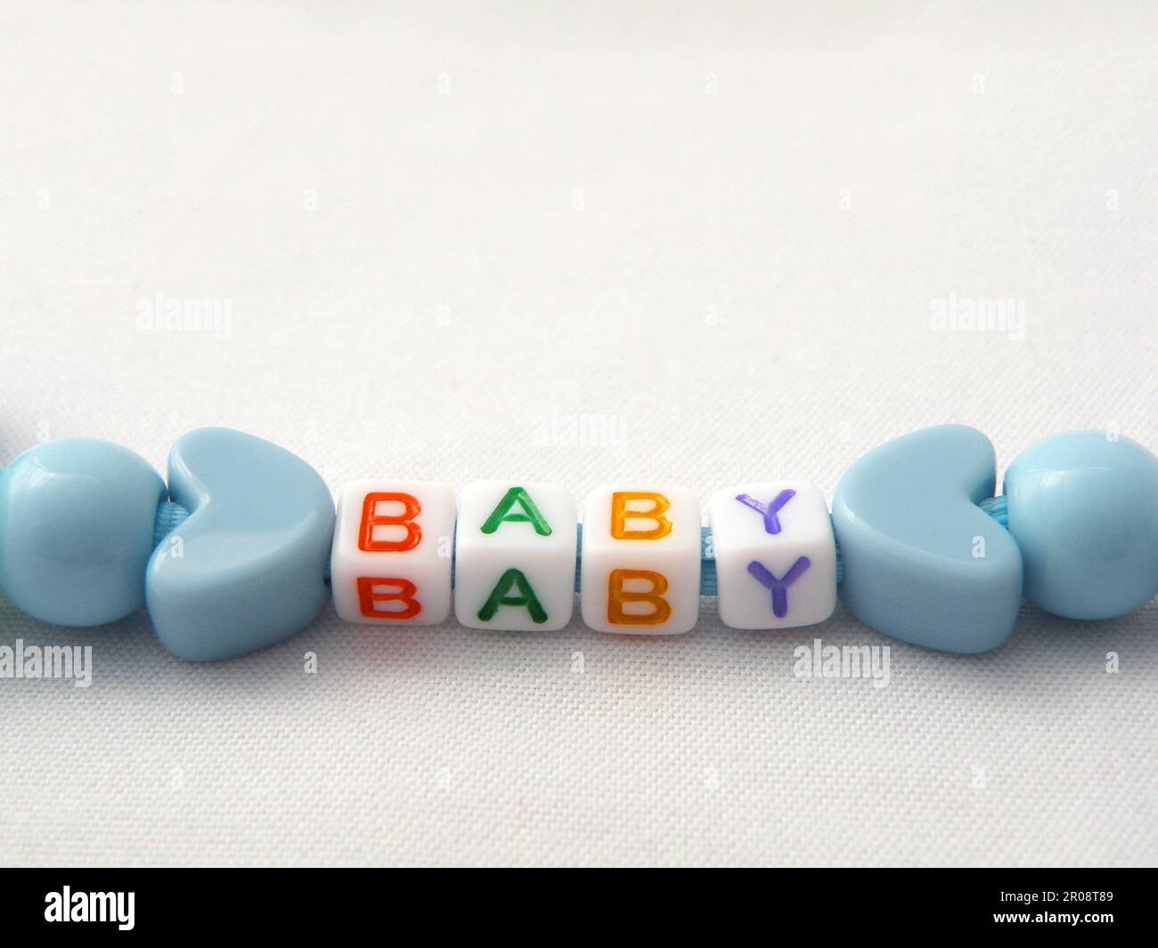 Baby word formed with cubes that are part of a pacifier clip Stock ...