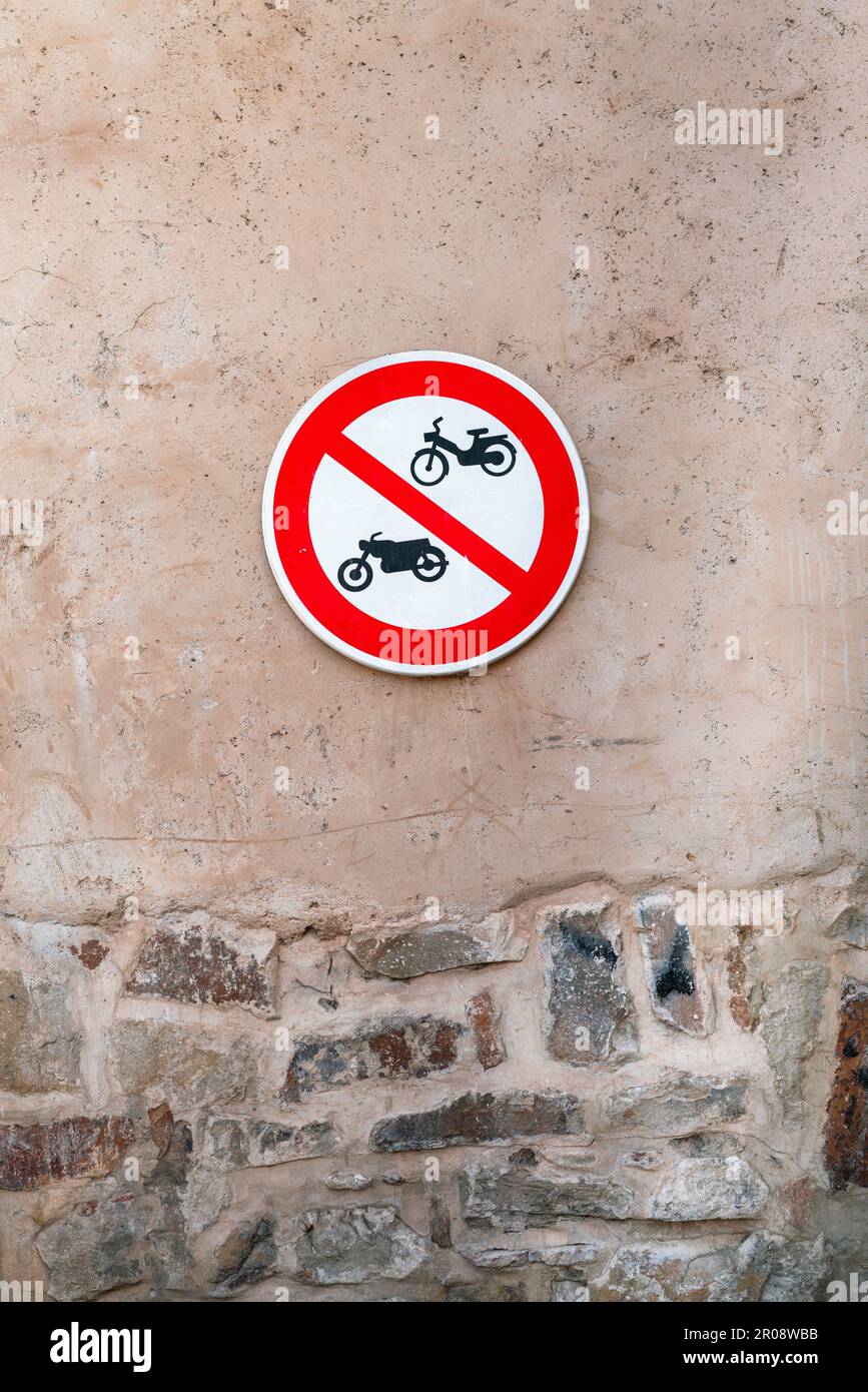 No motorcycle prohibition traffic sign attached to a wall Stock Photo ...