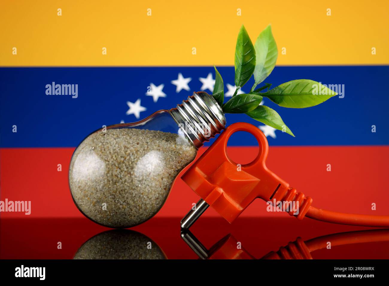 Plug, plant growing inside the light bulb and Venezuela Flag. Green eco ...