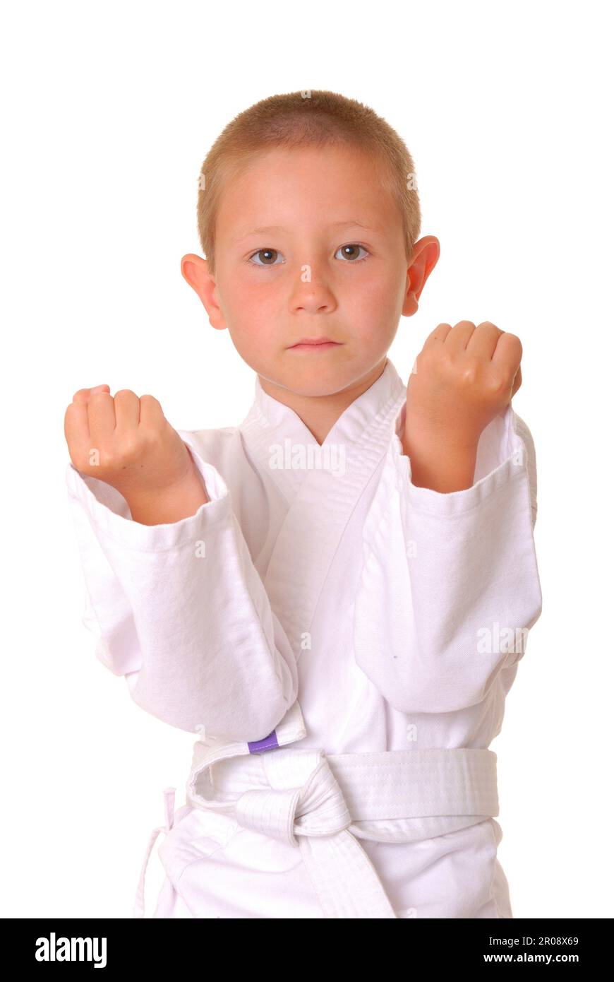 Young boy practicing karate isolated on white Stock Photo - Alamy