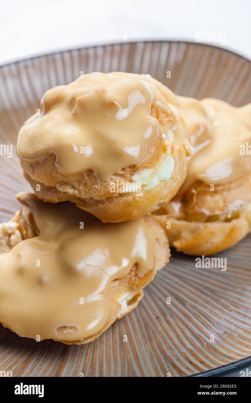 Three cream puffs hi-res stock photography and images - Alamy