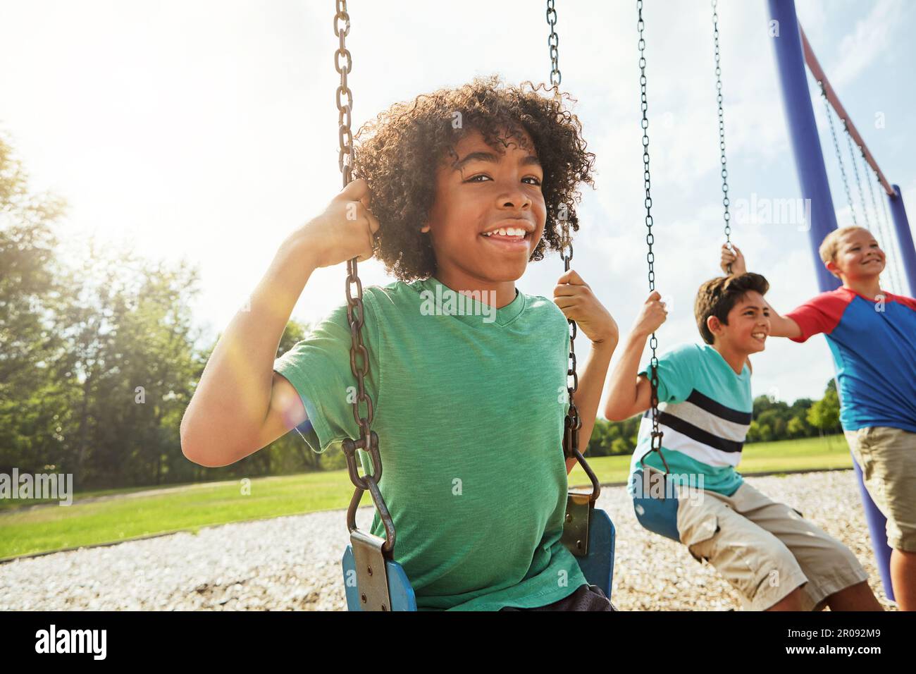 Making it a day of outdoor play. Portrait of a young boy playing on a ...