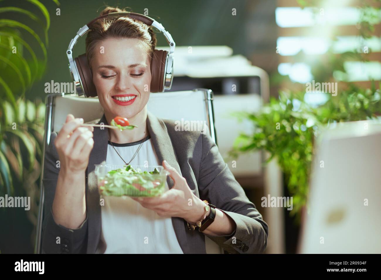 Sustainable workplace. smiling modern 40 years old bookkeeper woman in ...