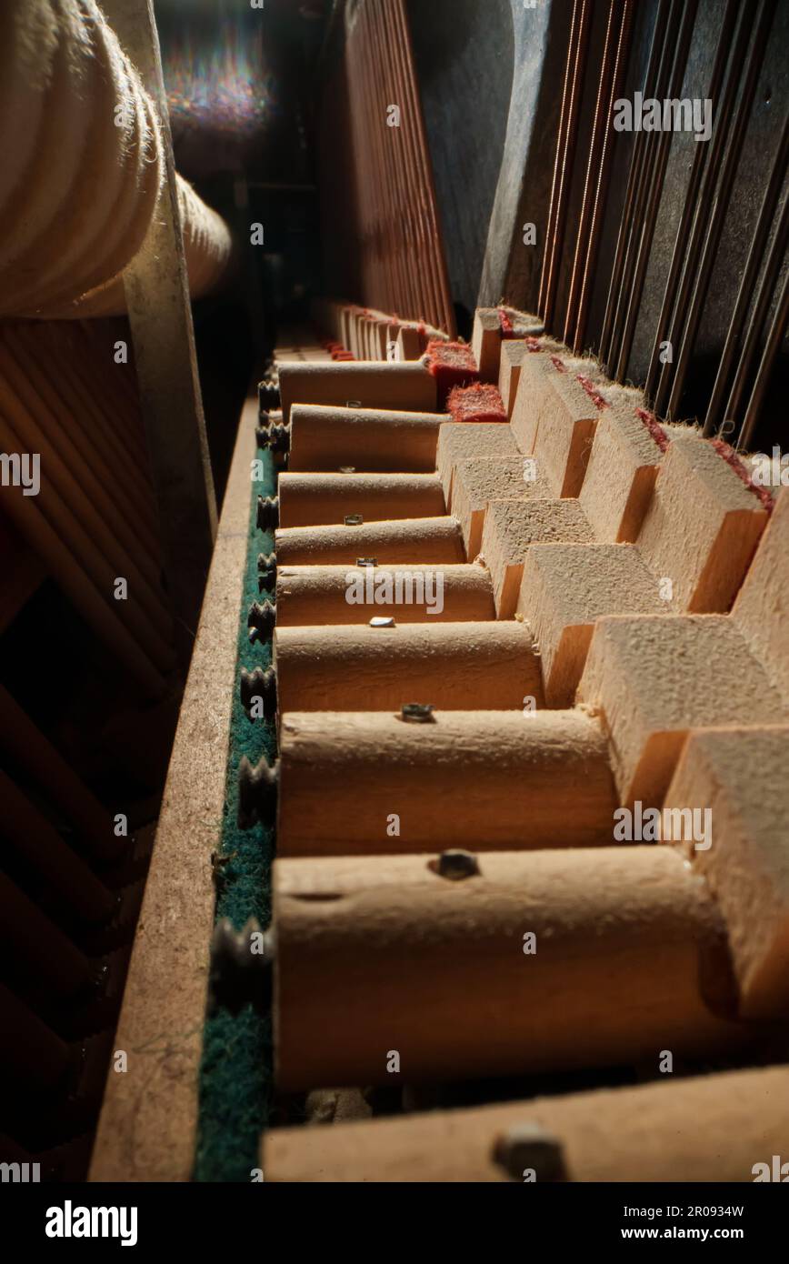 Inside the piano. Wooden mechanism inside the upright piano Stock Photo ...