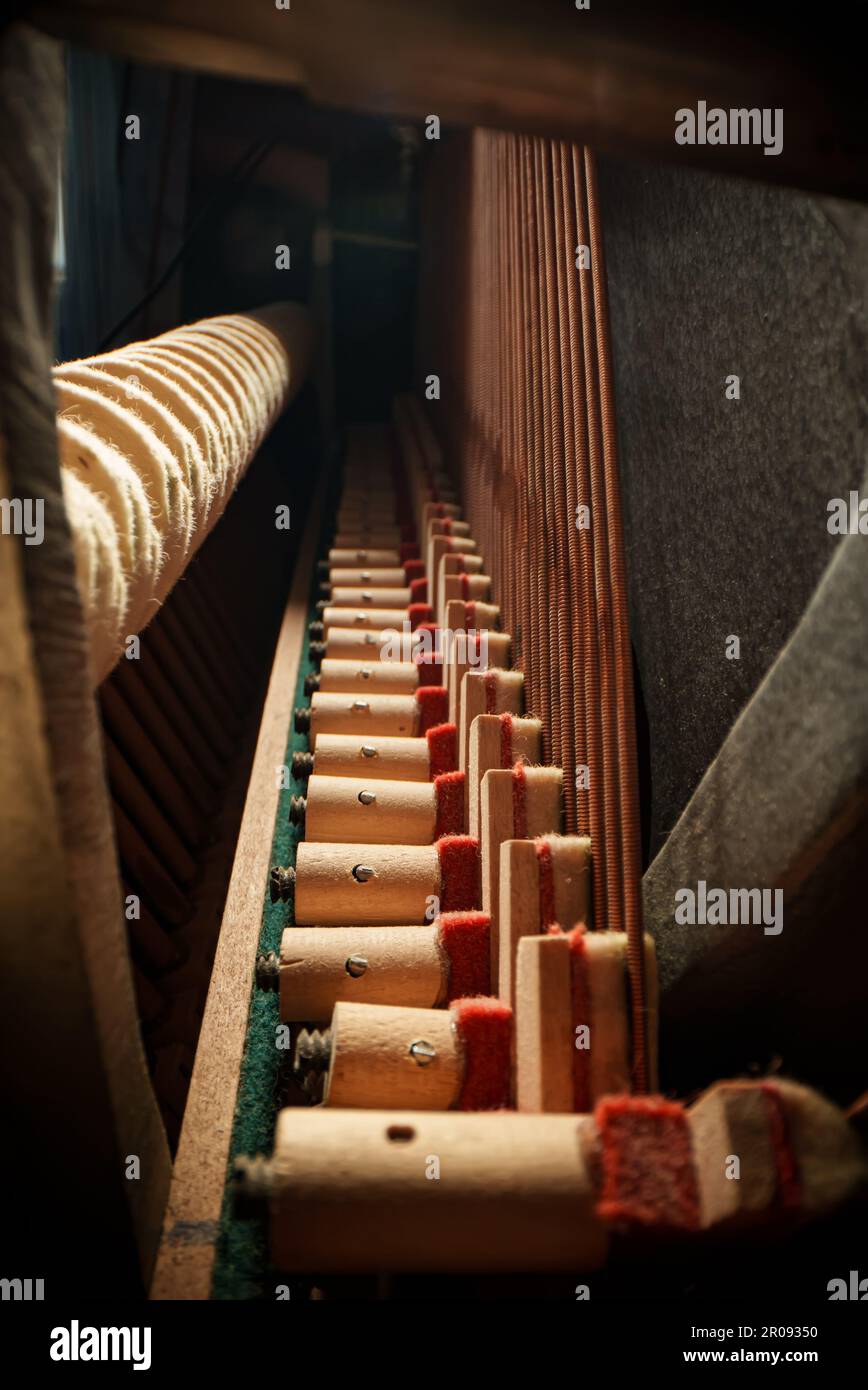 Inside the piano. Wooden mechanism inside the upright piano Stock Photo ...