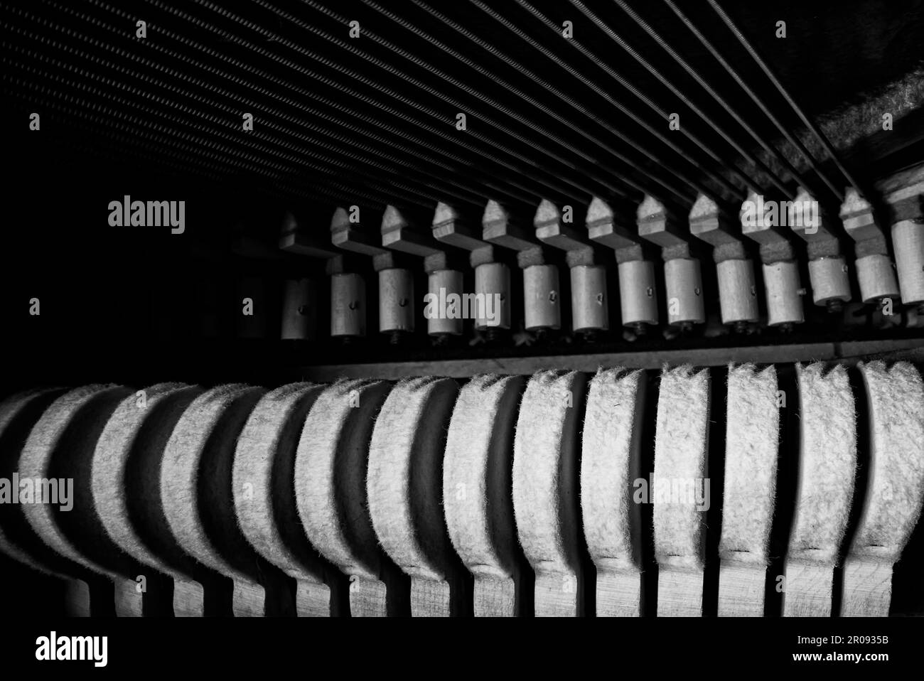 Inside the piano. Close-up view of hammers and strings inside the ...