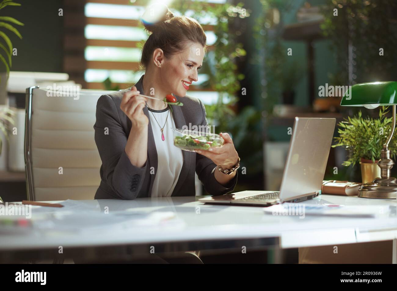 Sustainable workplace. happy modern 40 years old bookkeeper woman in a ...