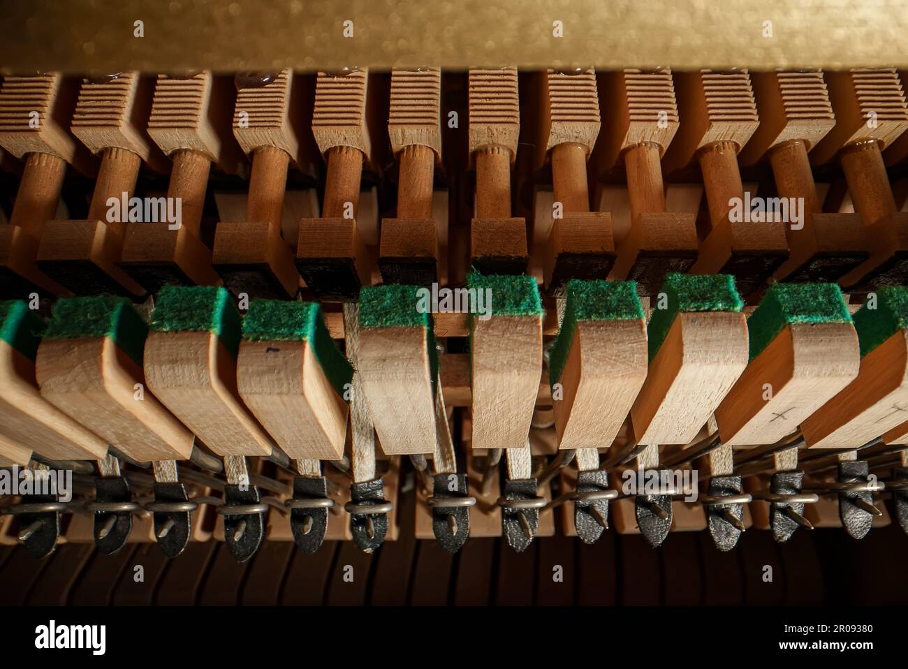 Inside the piano. Wooden mechanism inside the upright piano Stock Photo ...