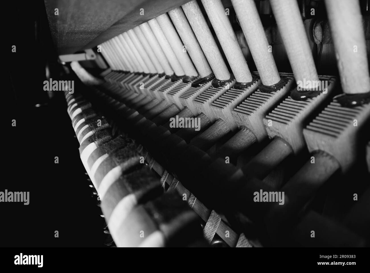 Inside the piano. Close-up view of hammers and strings inside the ...