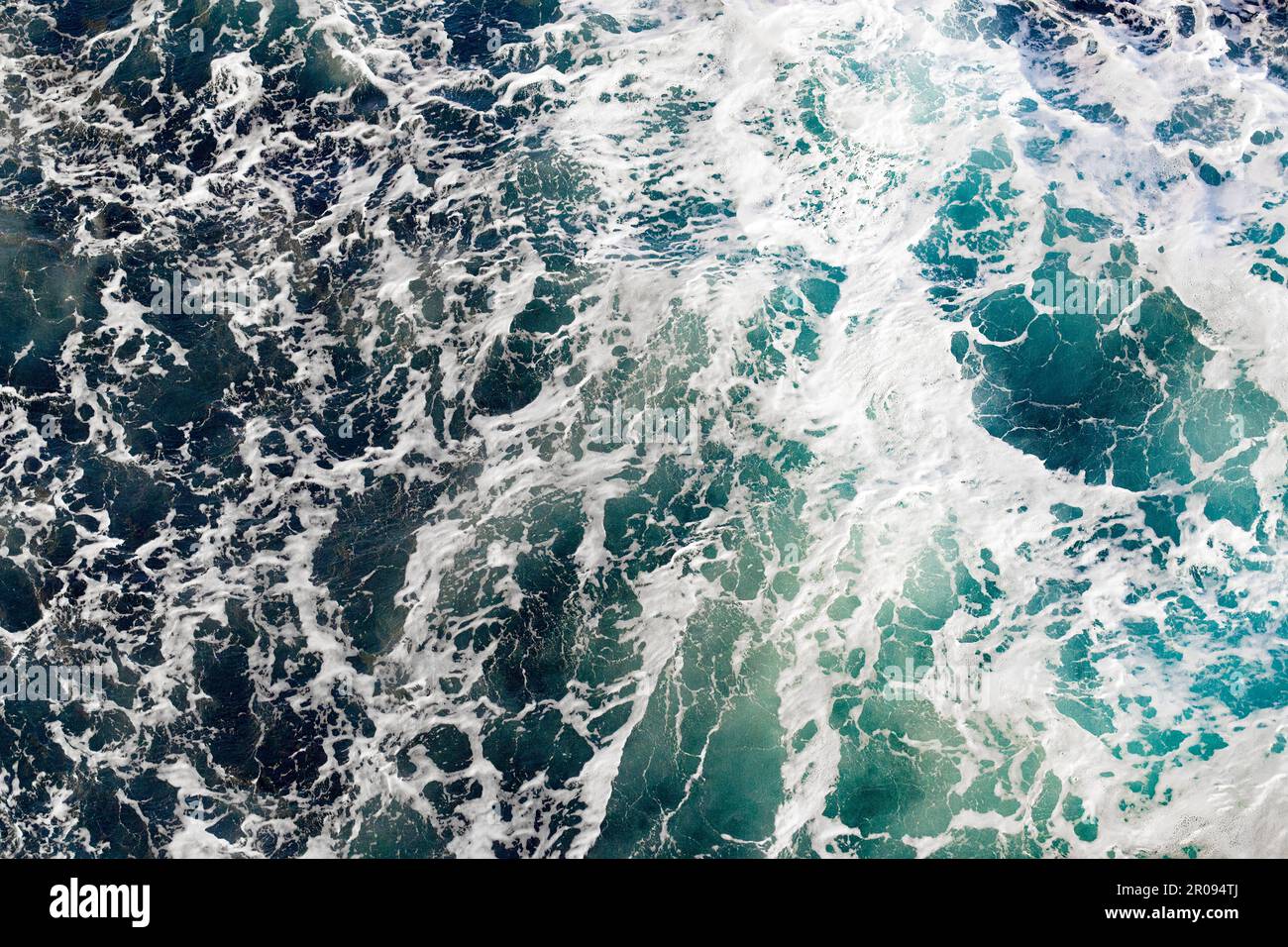 Blue waves, white sea foam background Stock Photo - Alamy
