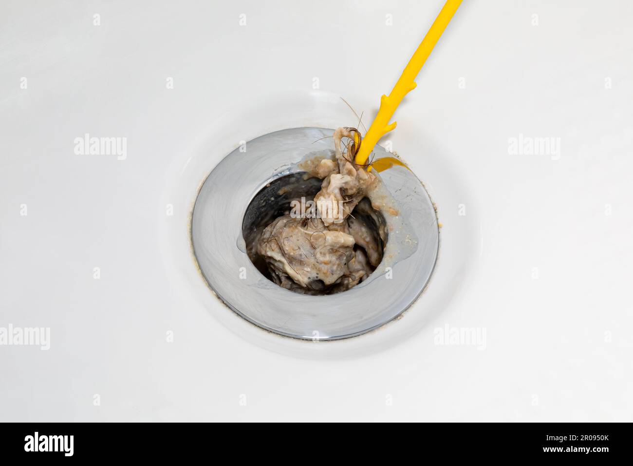 Cleaning Hair And Soap Scum From Clogged Shower And Bathtub Drain