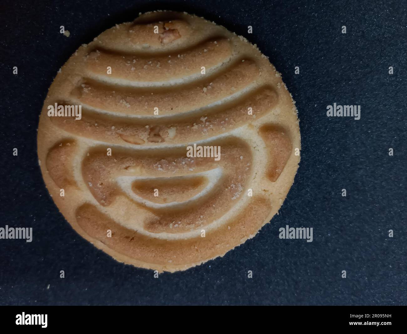 Round shape Indian biscuits on black background popularly known as Chai ...