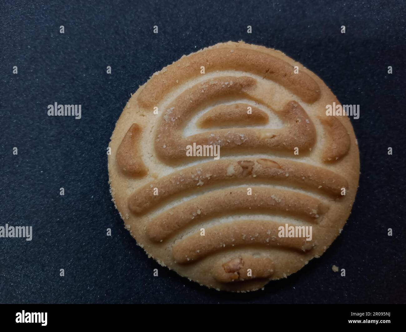 Round shape Indian biscuits on black background popularly known as Chai ...