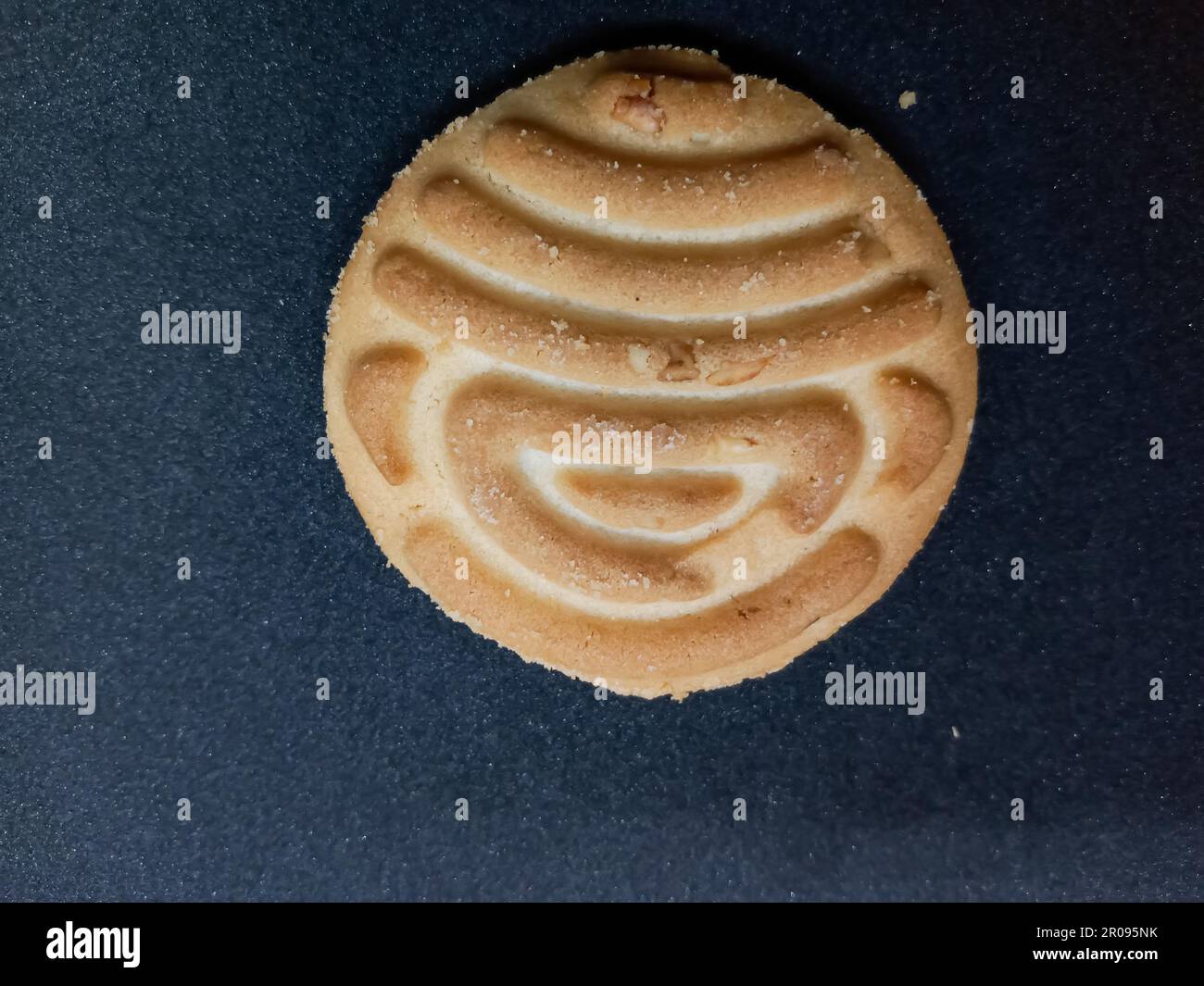 Round shape Indian biscuits on black background popularly known as Chai ...