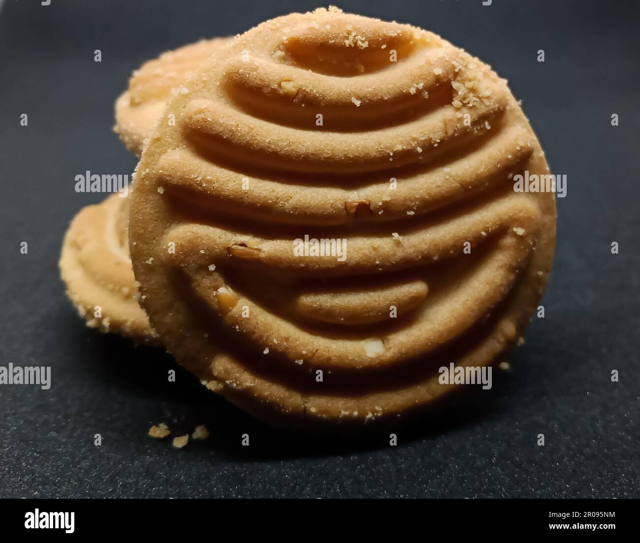 Round shape Indian biscuits on black background popularly known as Chai ...