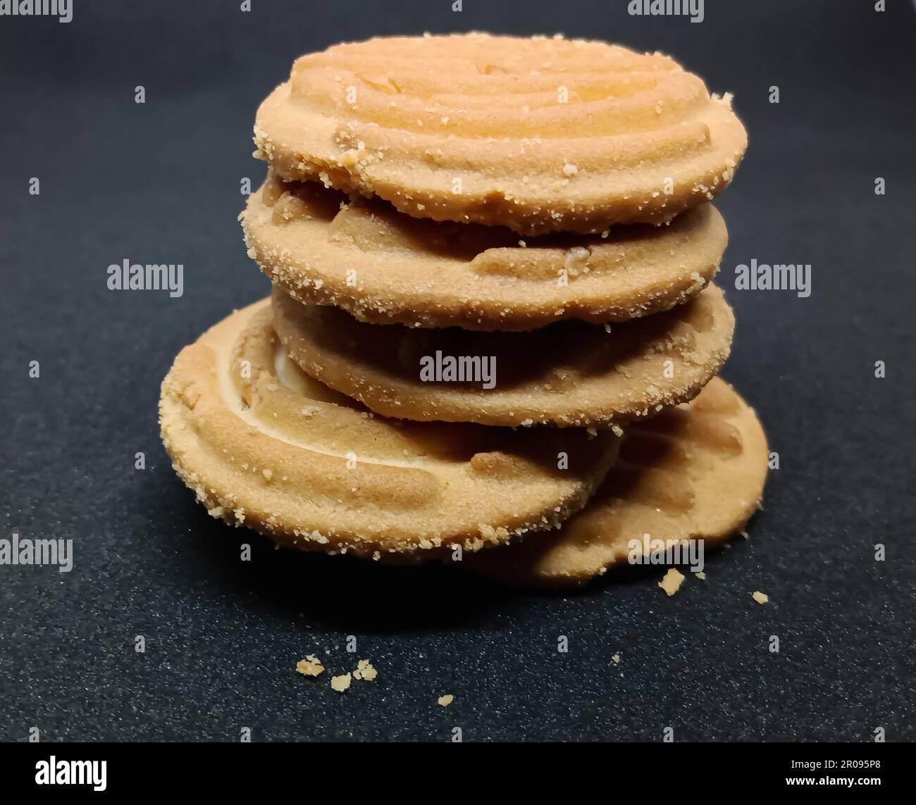 Round shape Indian biscuits on black background popularly known as Chai ...