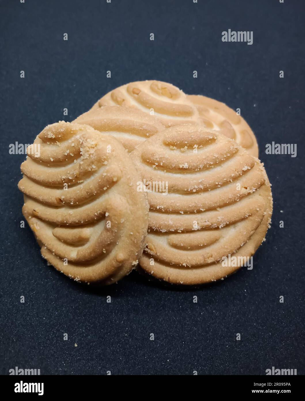 Round shape Indian biscuits on black background popularly known as Chai ...