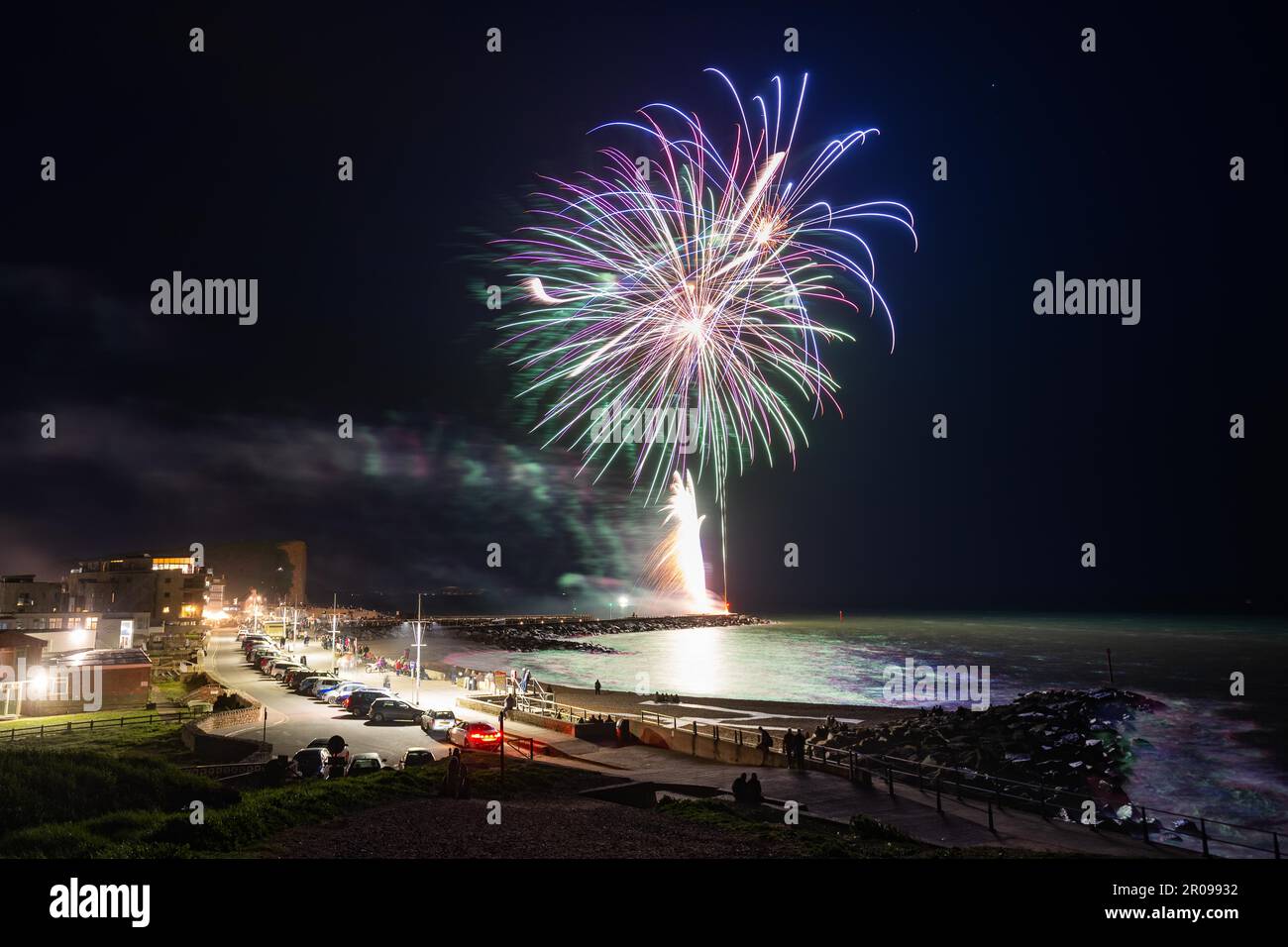 West Bay, Dorset, UK. 7th May 2023. A spectacular fireworks display at West Bay in Dorset during ...