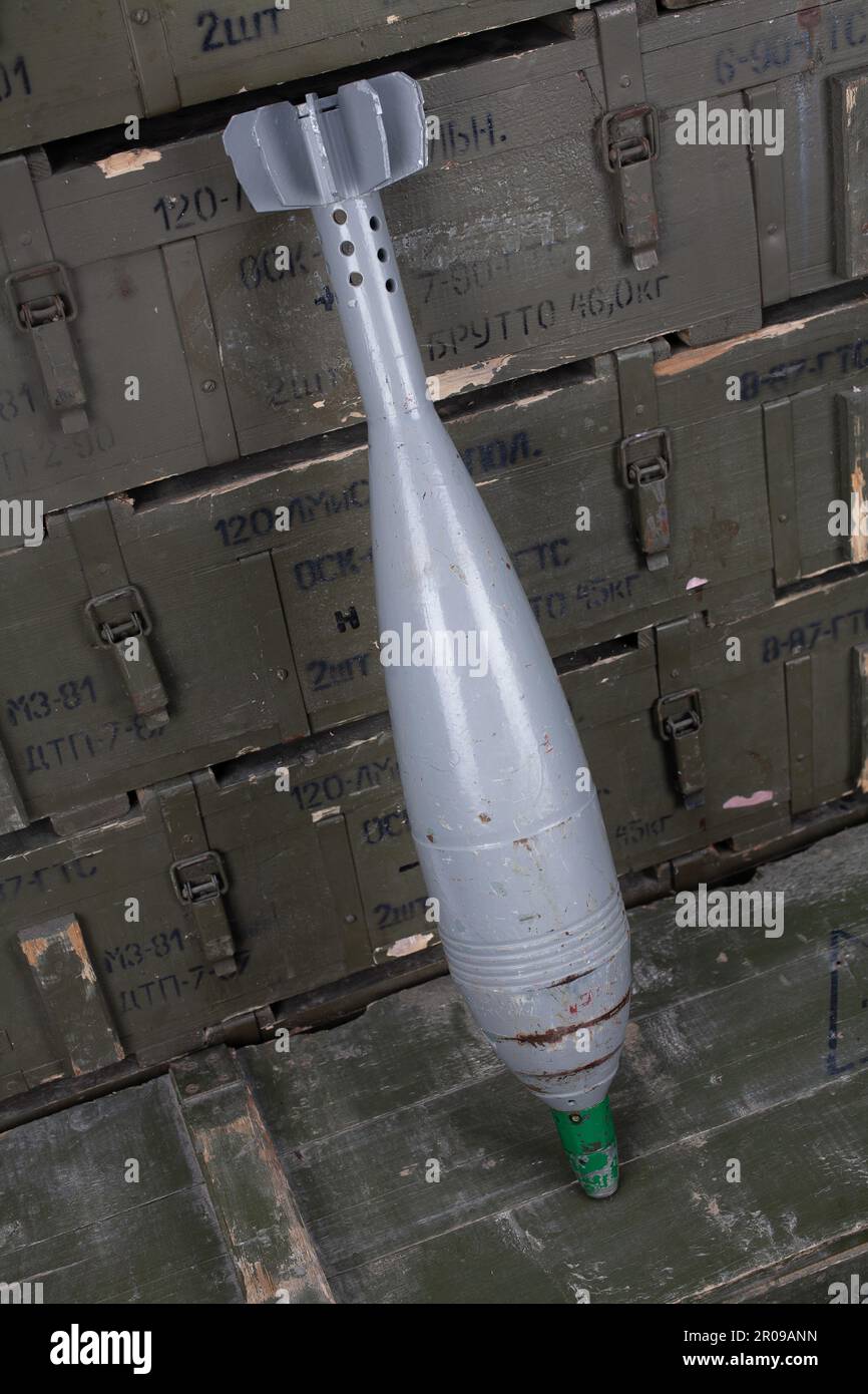 Soviet or russian 120 mm mortar shell on army green crate. Text in ...