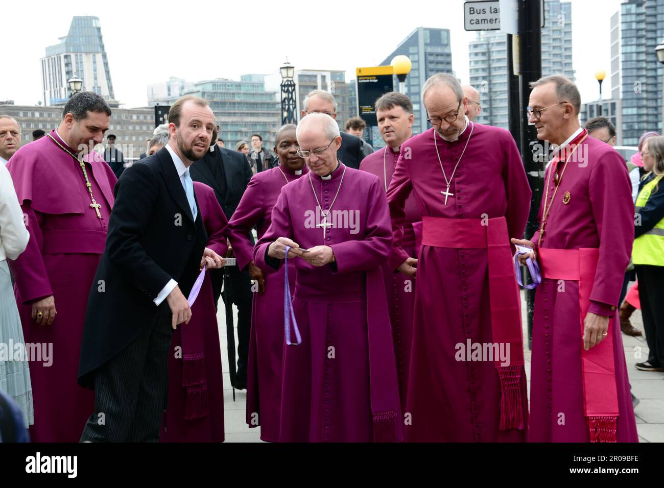 A relaxed Justin Welby heads casually over Lambeth Bridge on his way to ...
