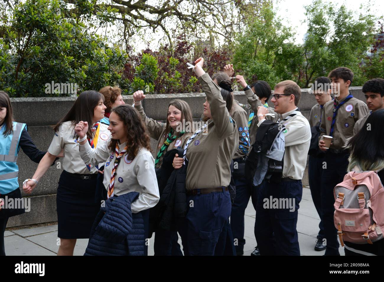 A happy group of scouts show their ID tags as they make their way to ...