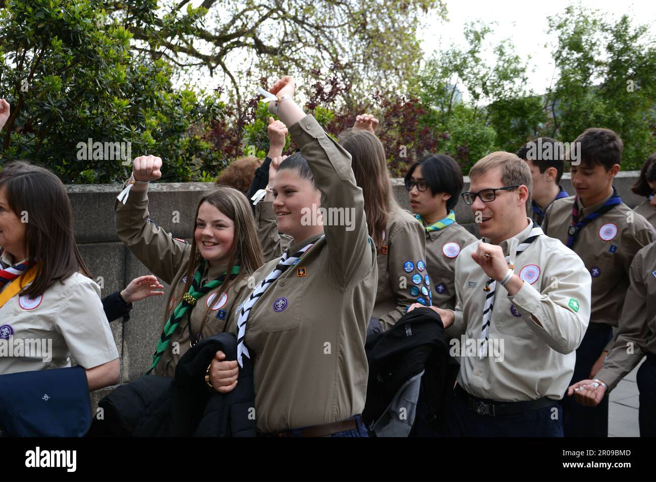 A happy group of scouts show their ID tags as they make their way to ...