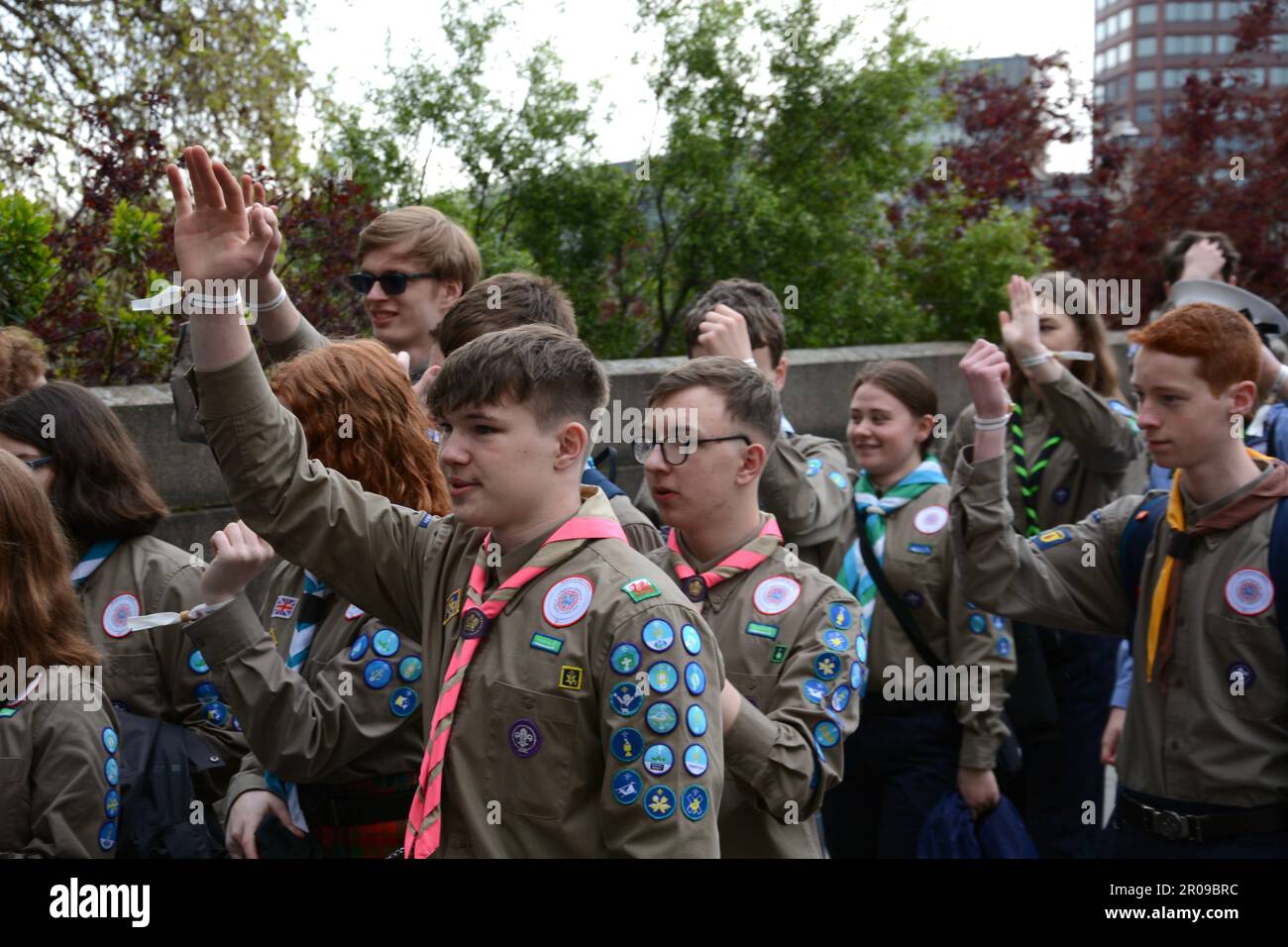 A happy group of scouts show their ID tags as they make their way to ...