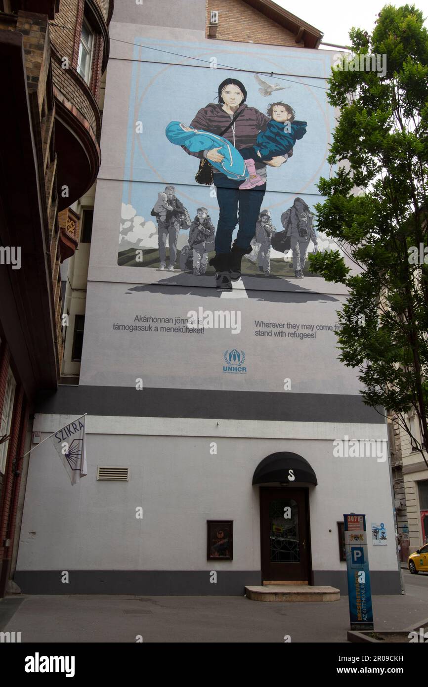 Refugees welcome - mural on a wall in Budapest depicting a woman ...