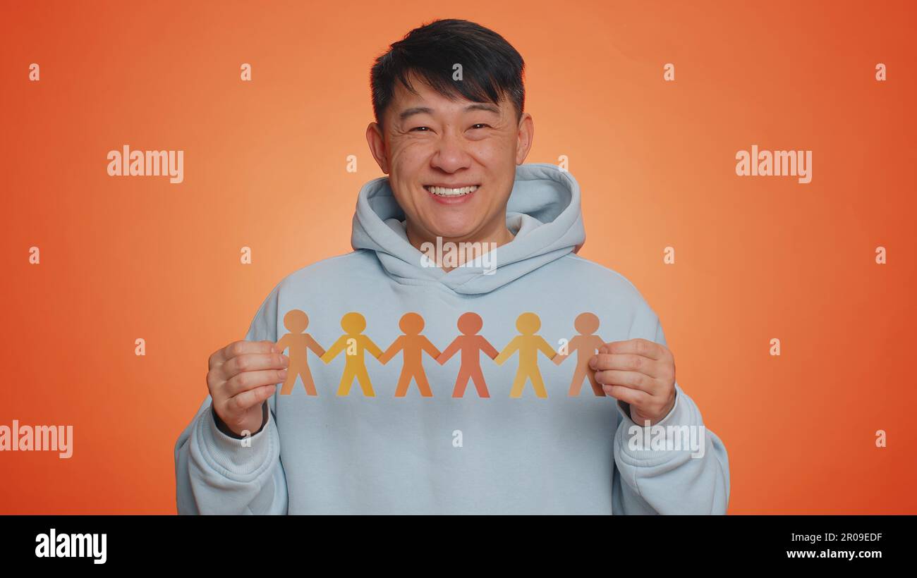 Man showing multiracial different skin color human shape cut out of ...