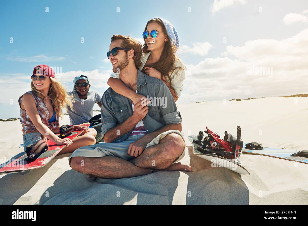 Sand boarding is better when you share it with friends. a group of ...